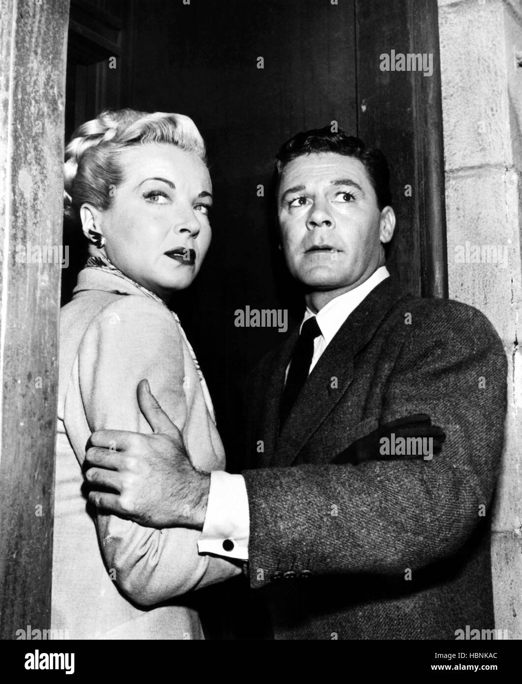 DRAGON'S GOLD, from left, Hillary Brooke, John Archer, 1954 Stock Photo ...