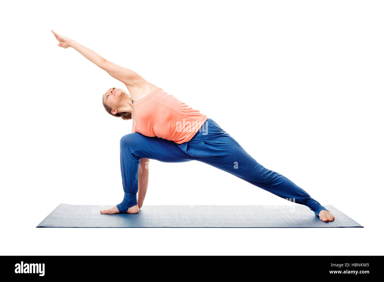 Woman doing Ashtanga Vinyasa Yoga asana Utthita parsvakonasana Stock ...