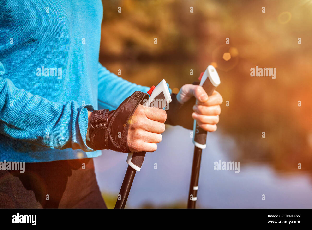 Closeup of woman's hand holding nordic walking poles Stock Photo - Alamy