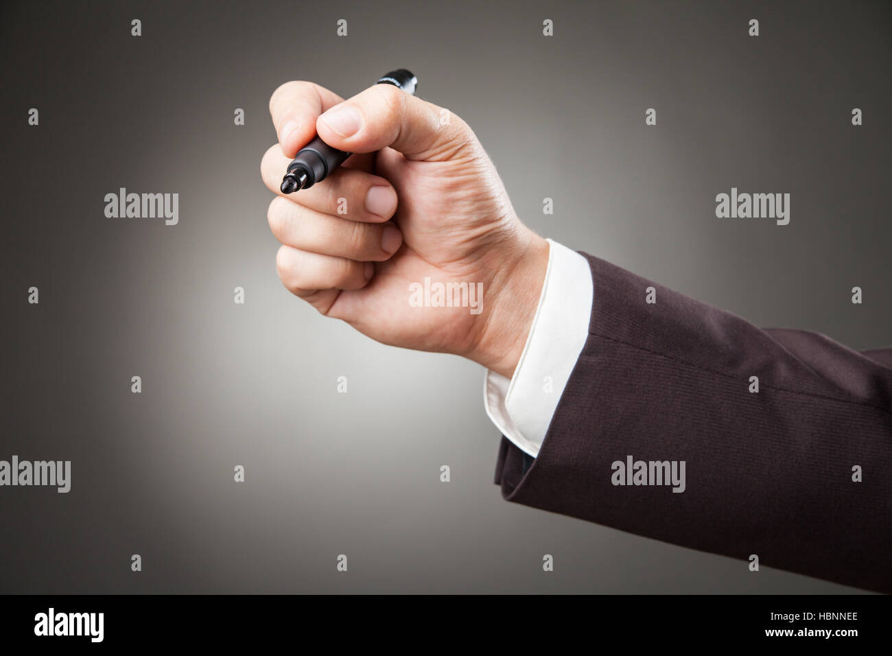 Hand holding marker Stock Photo - Alamy