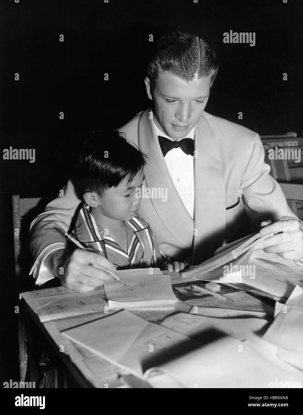 DULCY, from left: Donald Huie, Dan Dailey studying between scenes, 1940 ...
