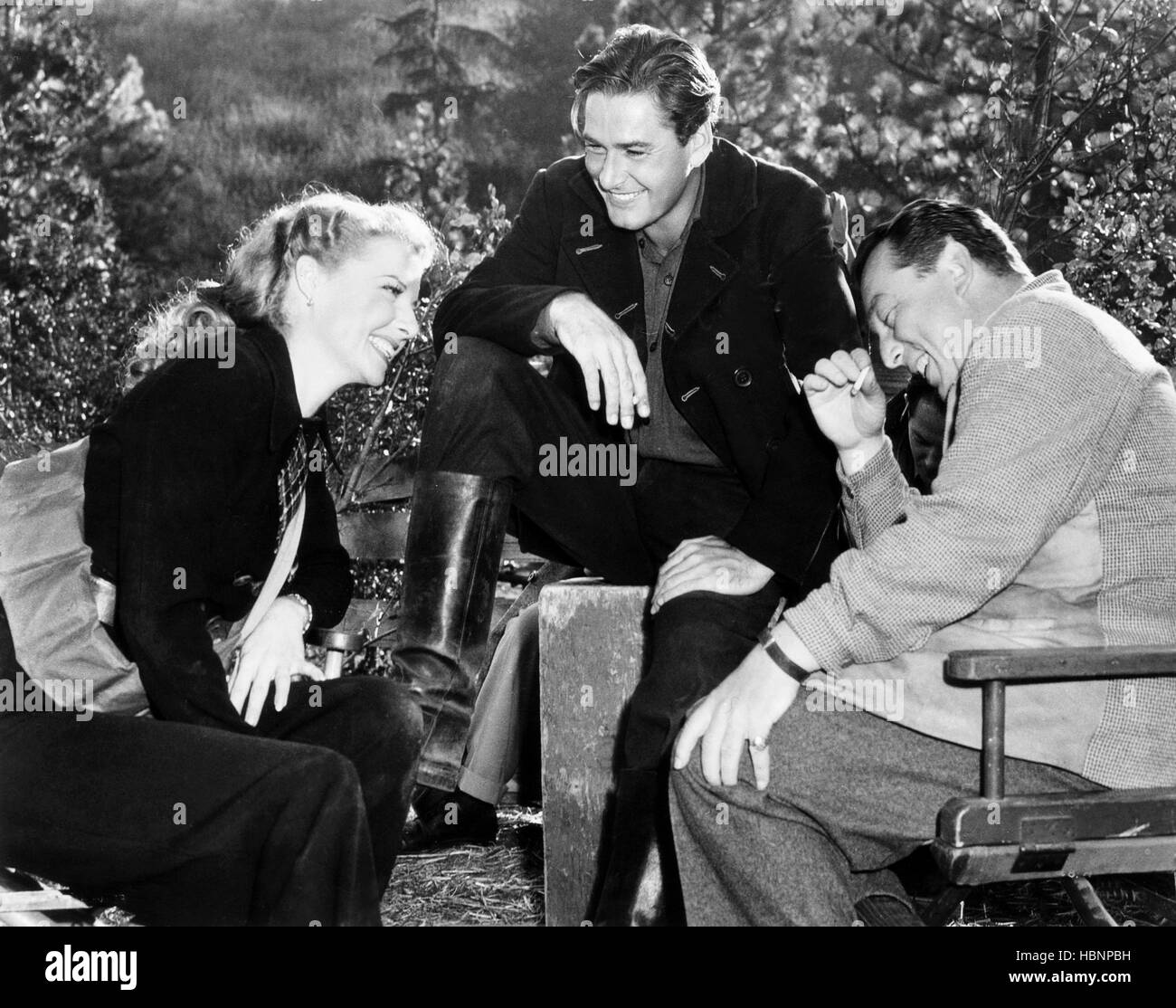 EDGE OF DARKNESS, from left, Ann Sheridan, Errol Flynn, director Lewis ...