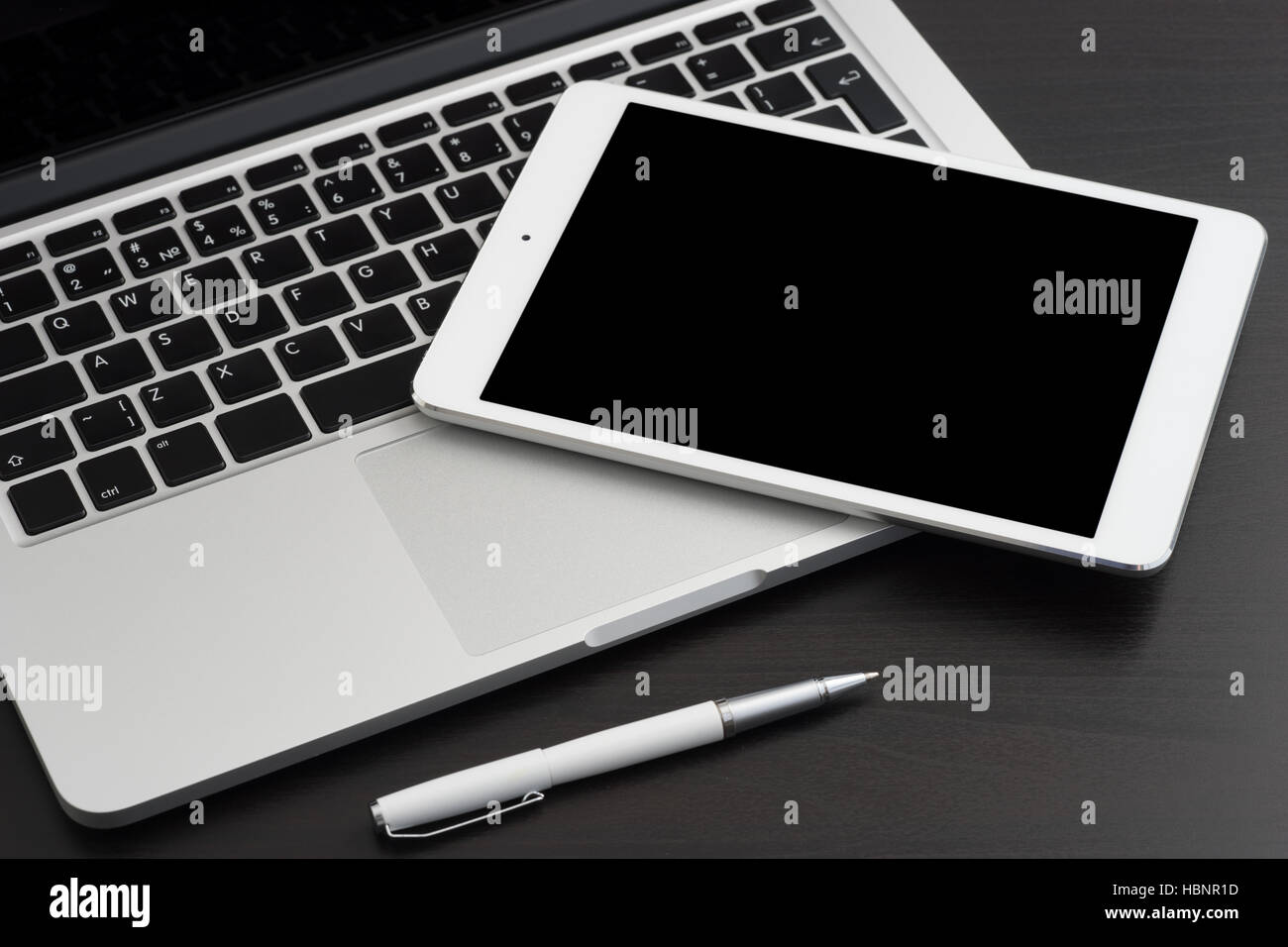 Laptop and tablet computer ballpoint pen, isolated Stock Photo - Alamy