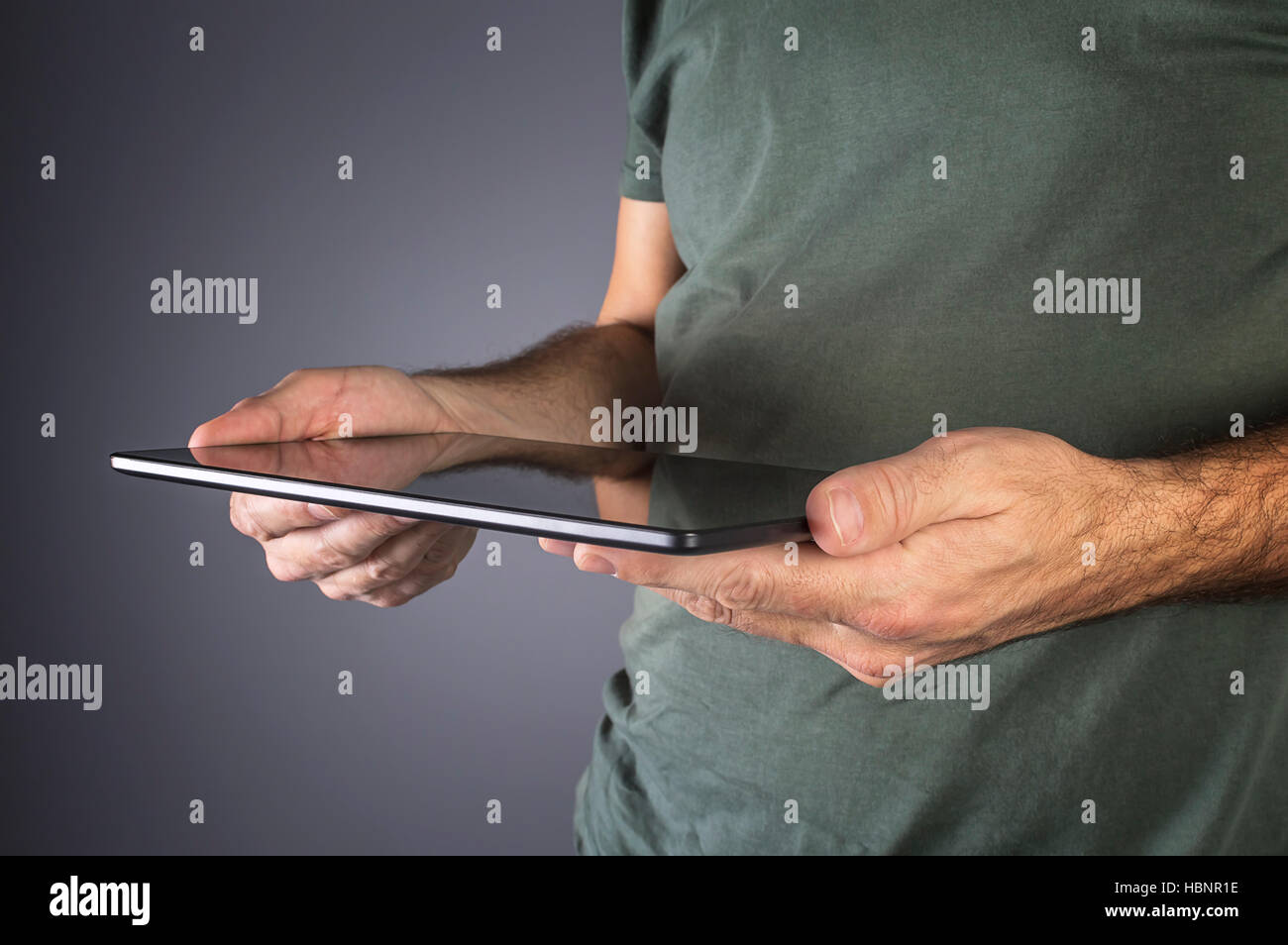 Male hand holding a modern tablet. Business, technology, internet and ...