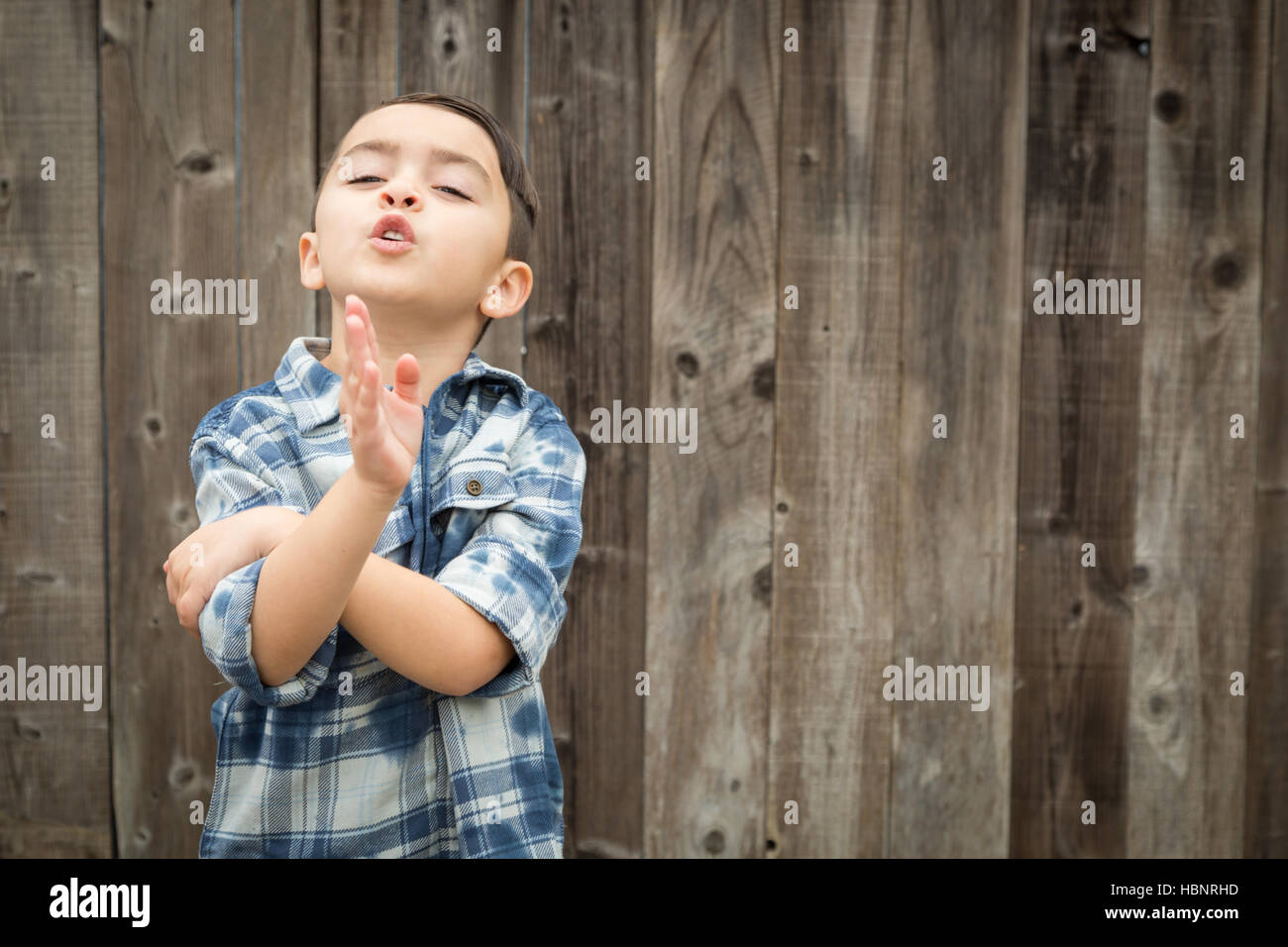Expressive Young Mixed Race Boy Making Hand Gestures Stock Photo - Alamy