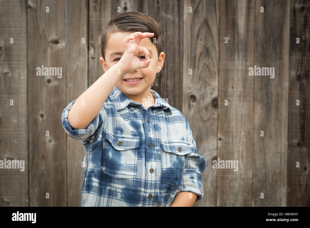 Happy Young Mixed Race Boy Making Okay Hand Gesture Stock Photo - Alamy