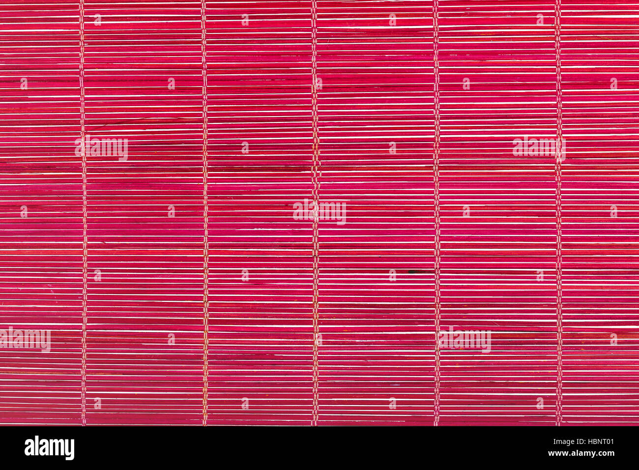 Red bamboo mat, background Stock Photo - Alamy