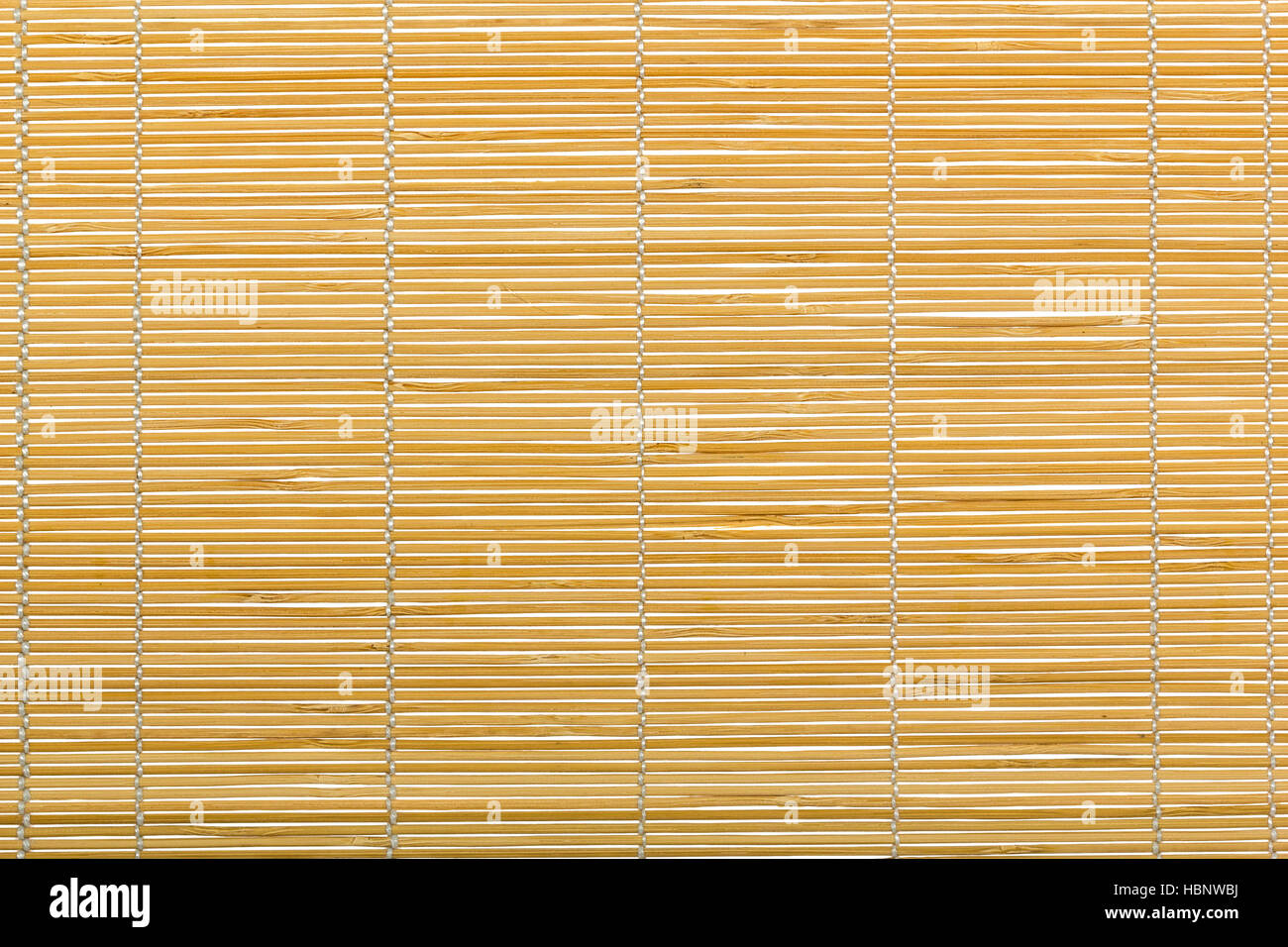 Yellow bamboo mat, background Stock Photo - Alamy
