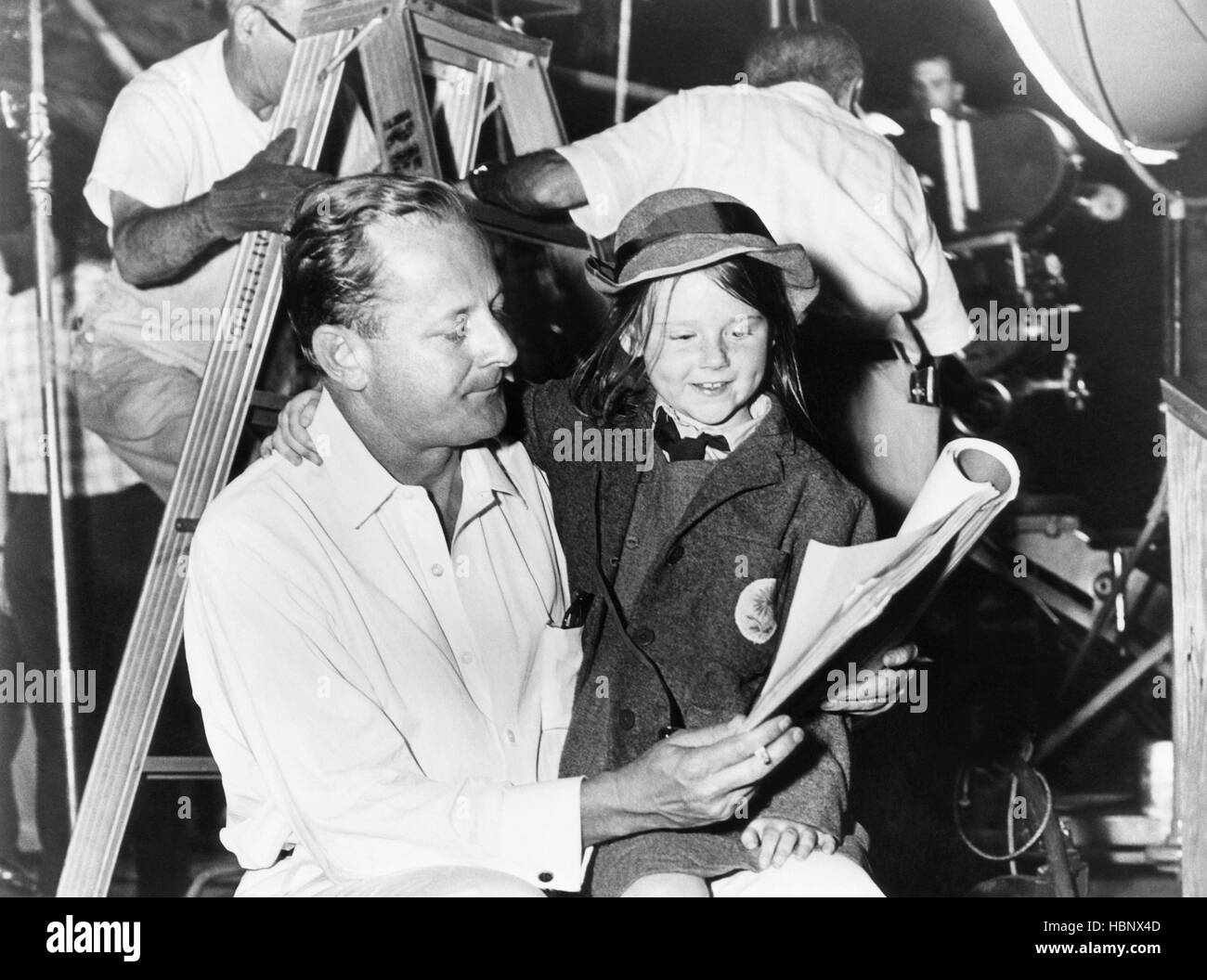 FATHER GOOSE, director Ralph Nelson going over script with Pip Sparke ...