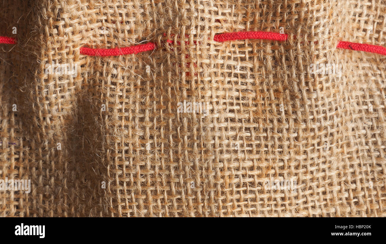 Close up shot of burlap texture background with red stitching Stock ...
