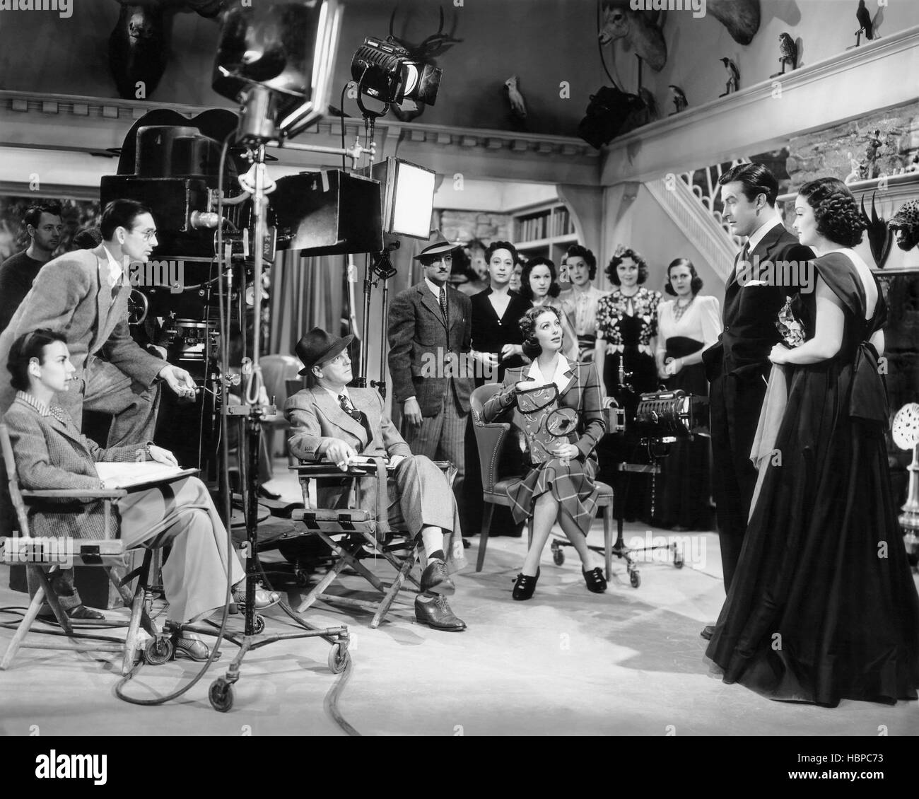 THE DOCTOR TAKES A WIFE, cinematographer Sidney Hickox, (standing, left ...