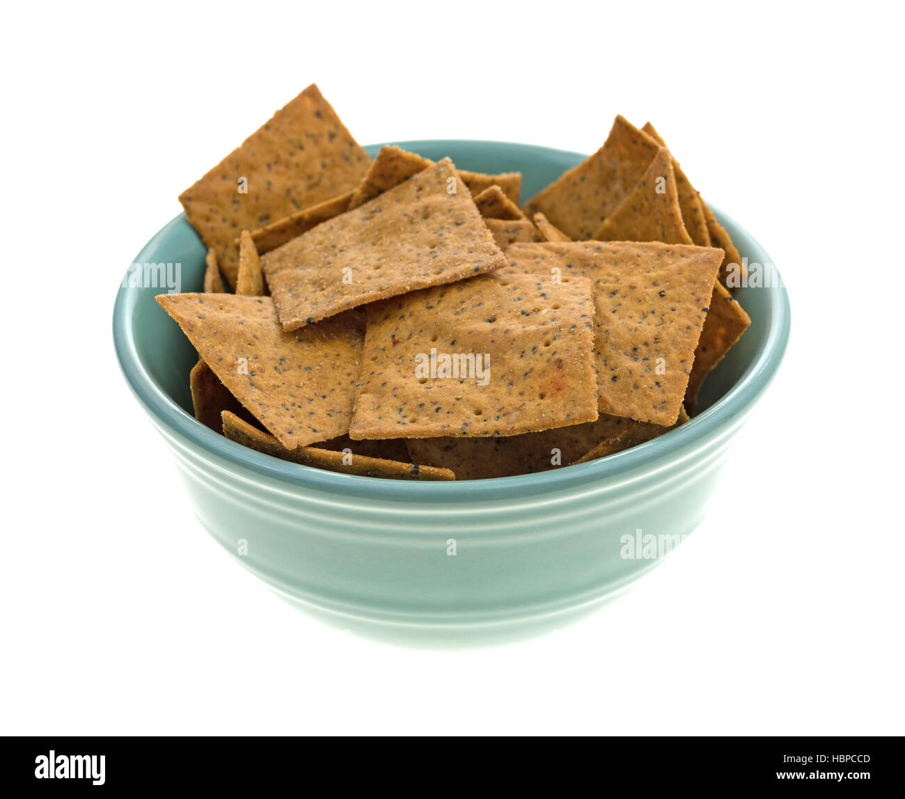 Portion of gourmet teff whole grain snack crackers in a green bowl ...