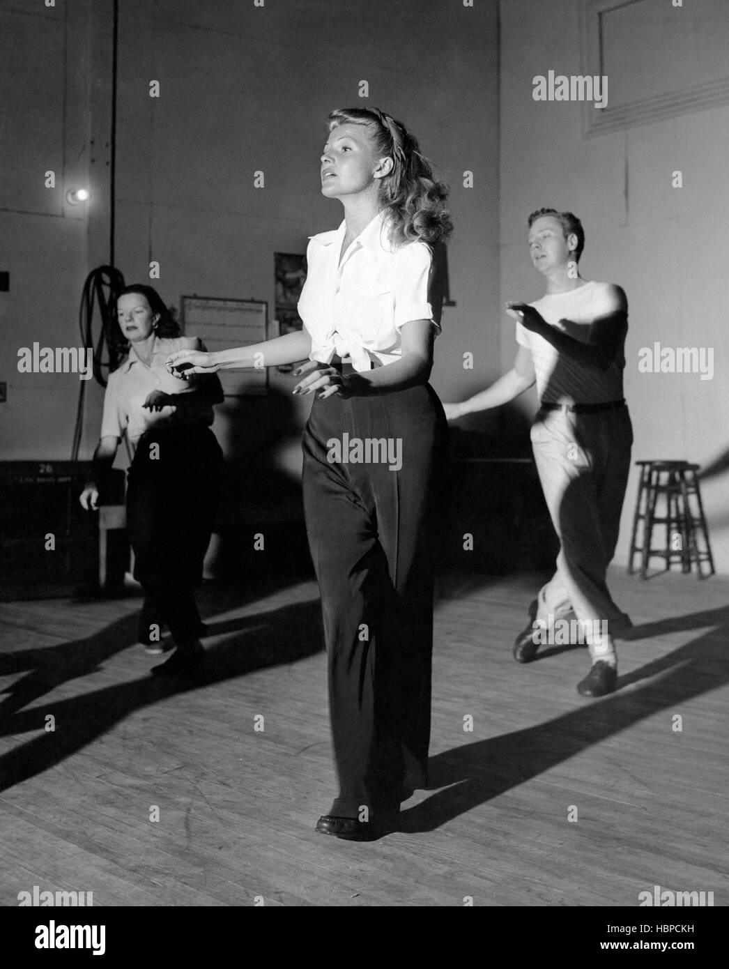 DOWN TO EARTH, from left, dance instructor Dorothy Fox, Rita Hayworth ...