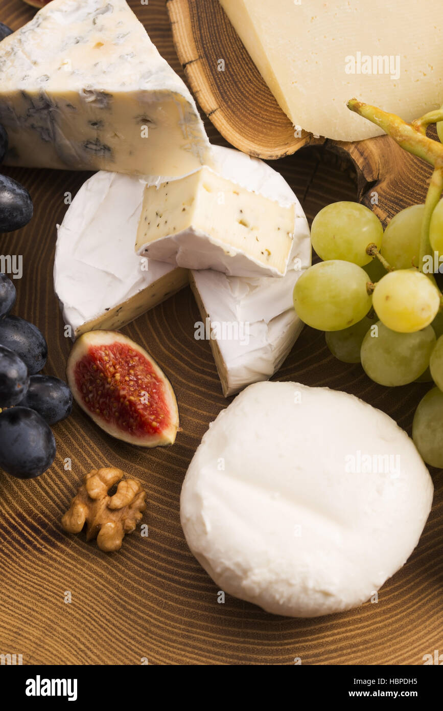 Assortment of cheese with fruits and grapes Stock Photo - Alamy
