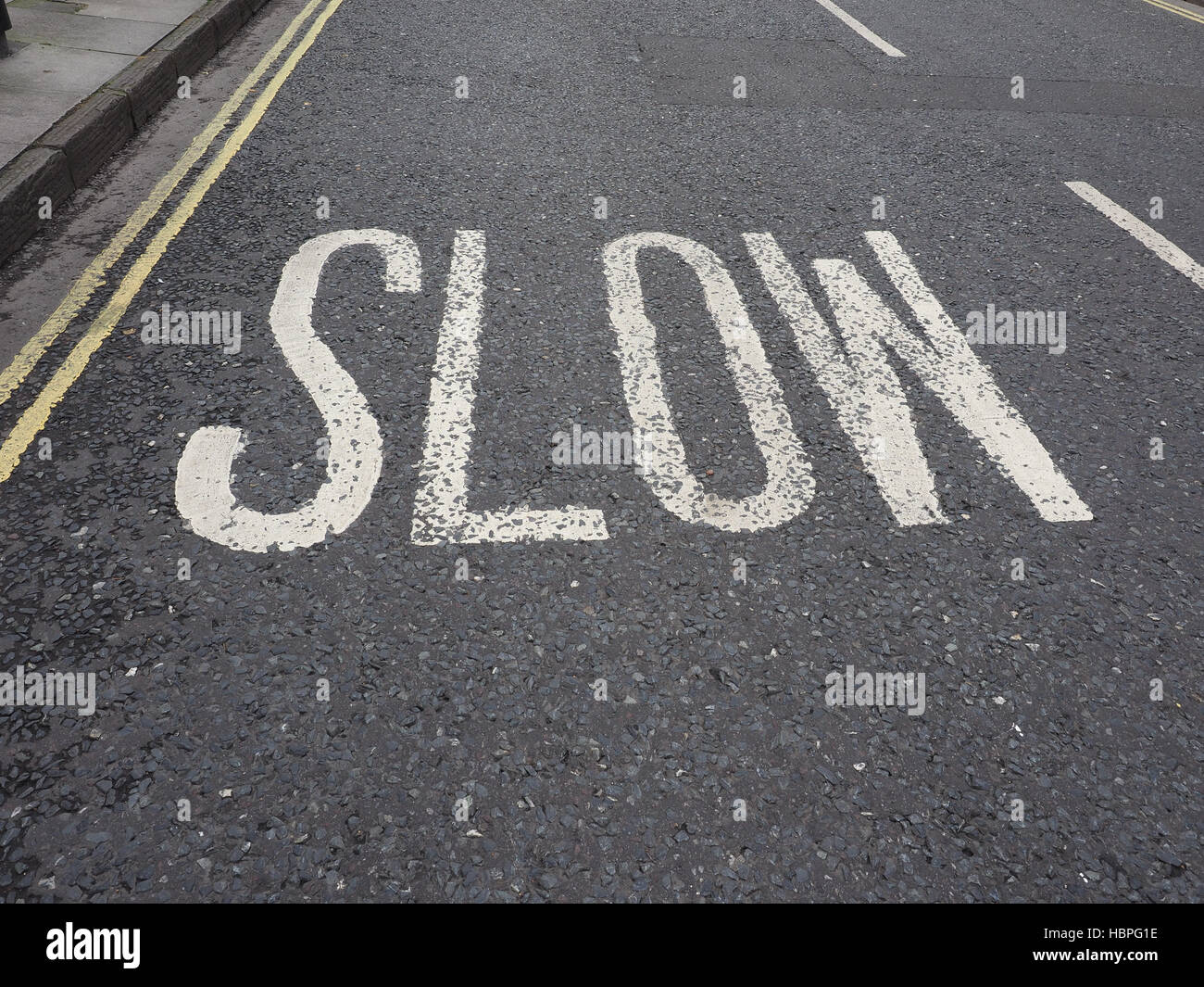 Slow street sign Stock Photo - Alamy