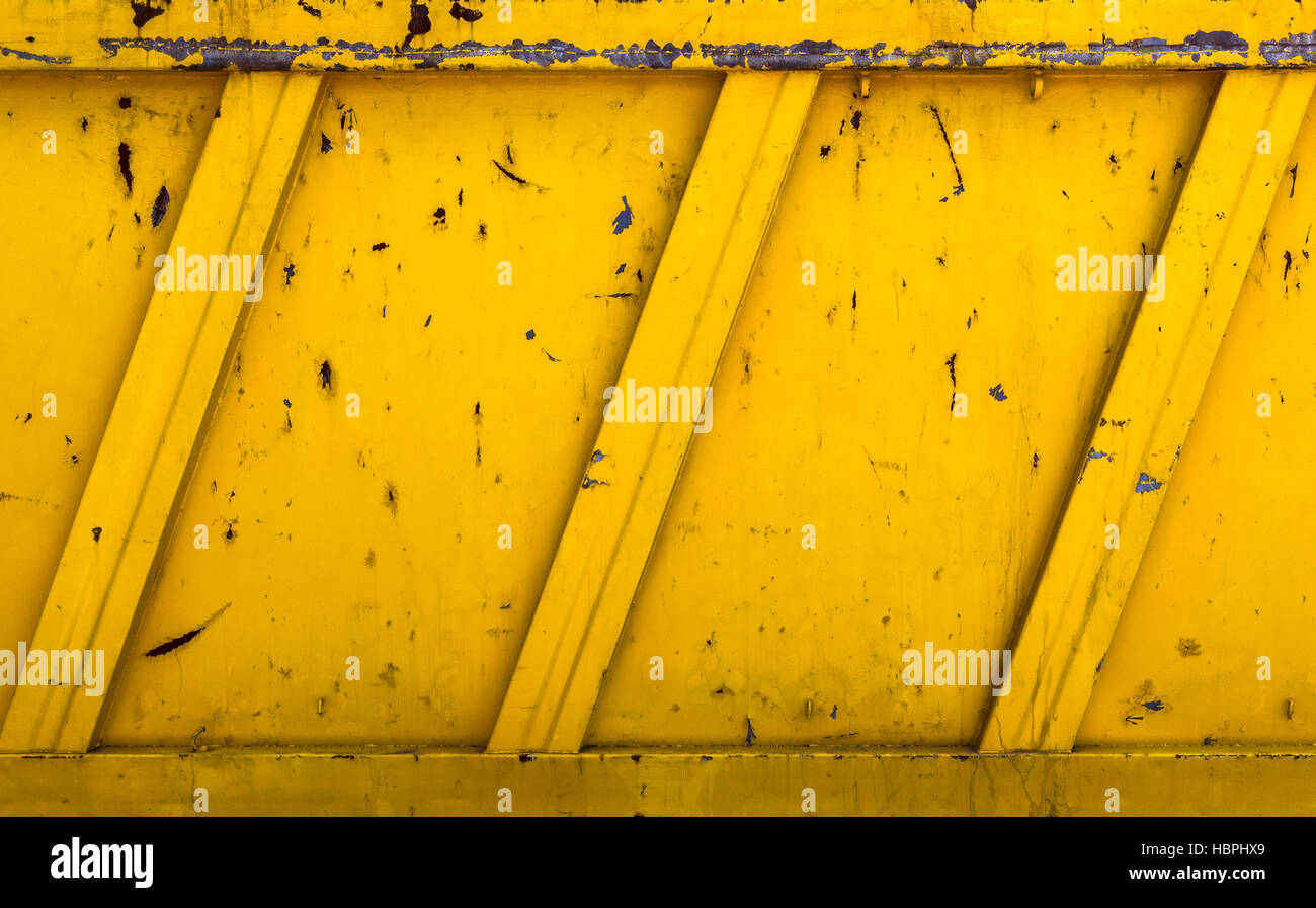 Yellow rubble container Stock Photo - Alamy
