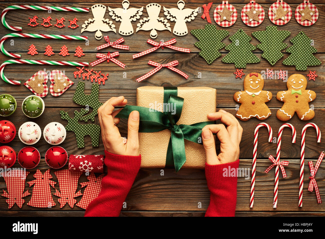 Female hands over christmas gift Stock Photo - Alamy