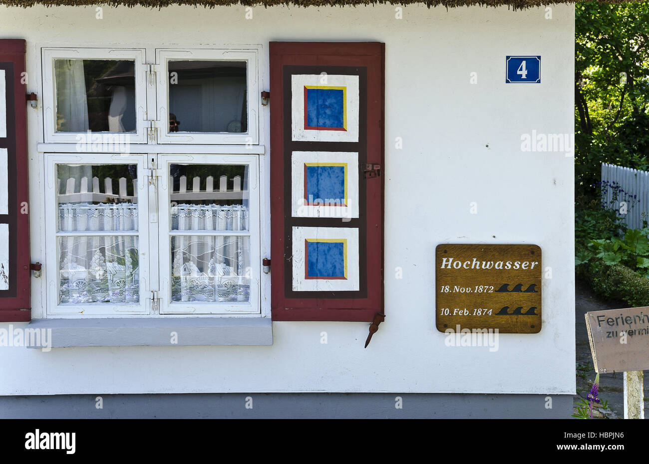 flood marks and colorful window shutter Stock Photo - Alamy