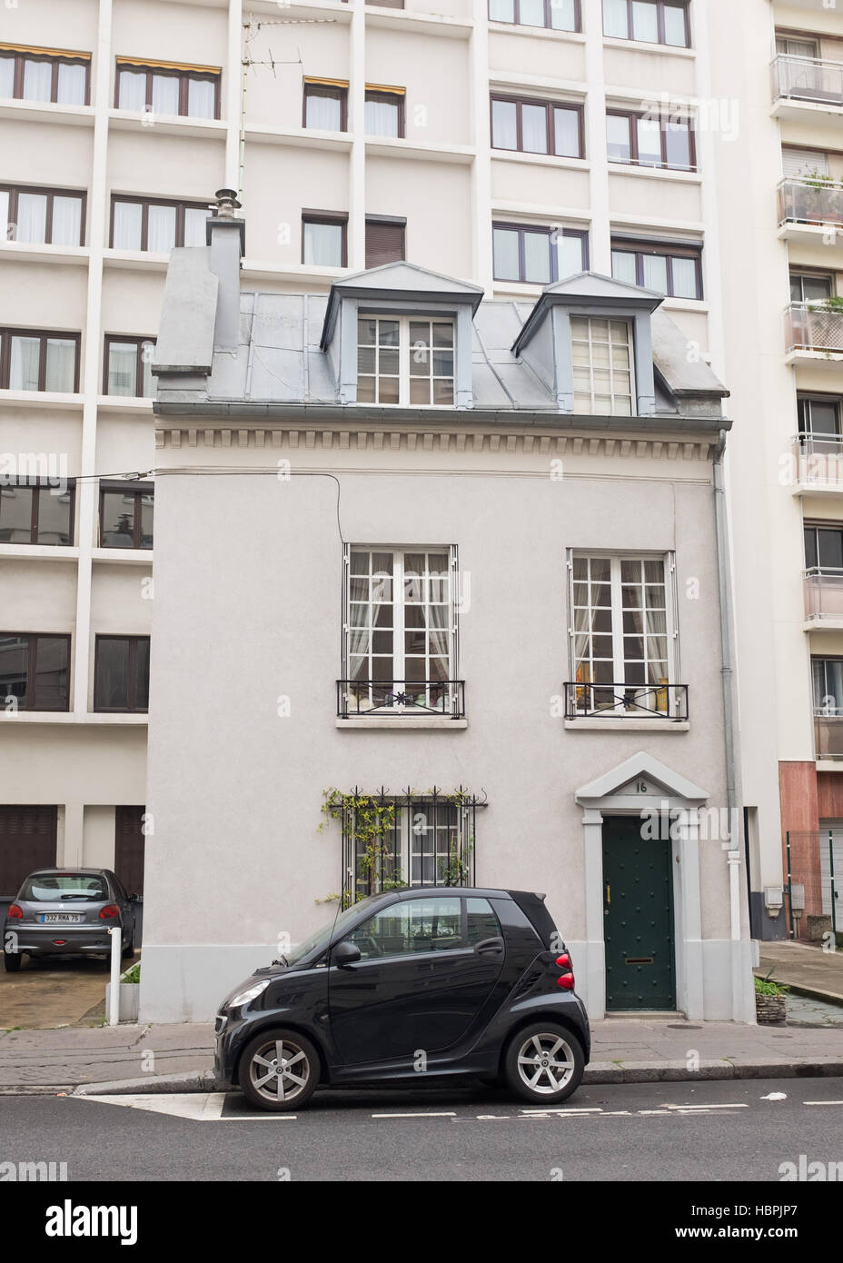 Small car parking in front of a very small house in Paris,France Stock ...