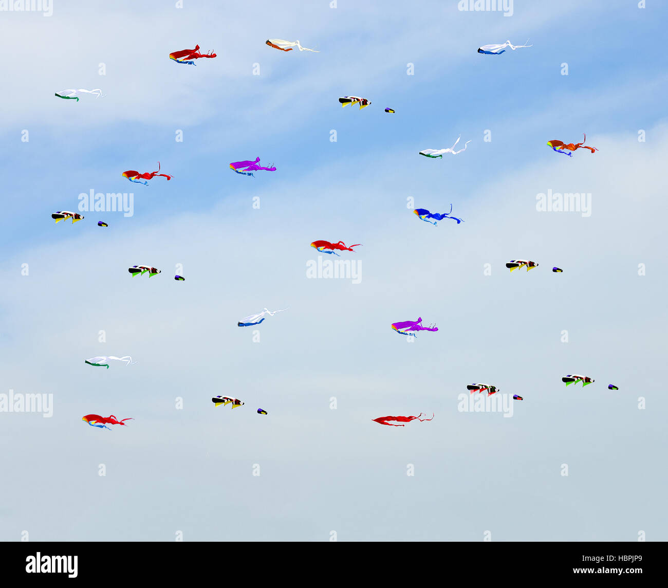 colorful kites at a blue sky Stock Photo - Alamy