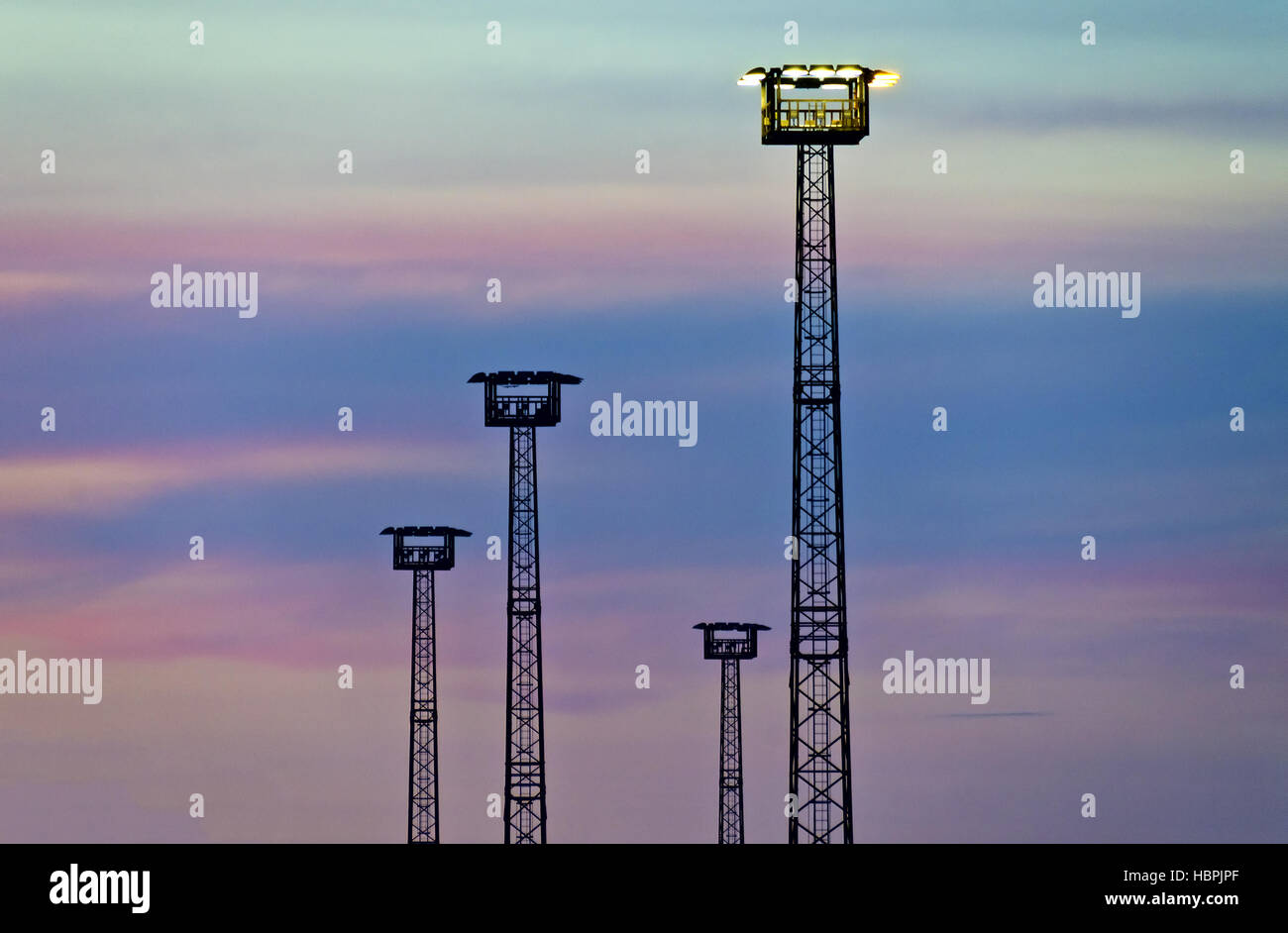 flood light towers at sundown Stock Photo - Alamy