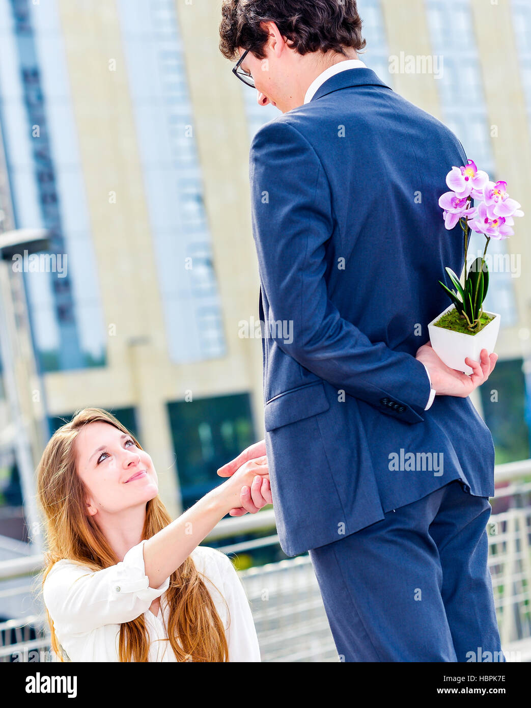 Male offering flowers Stock Photo - Alamy