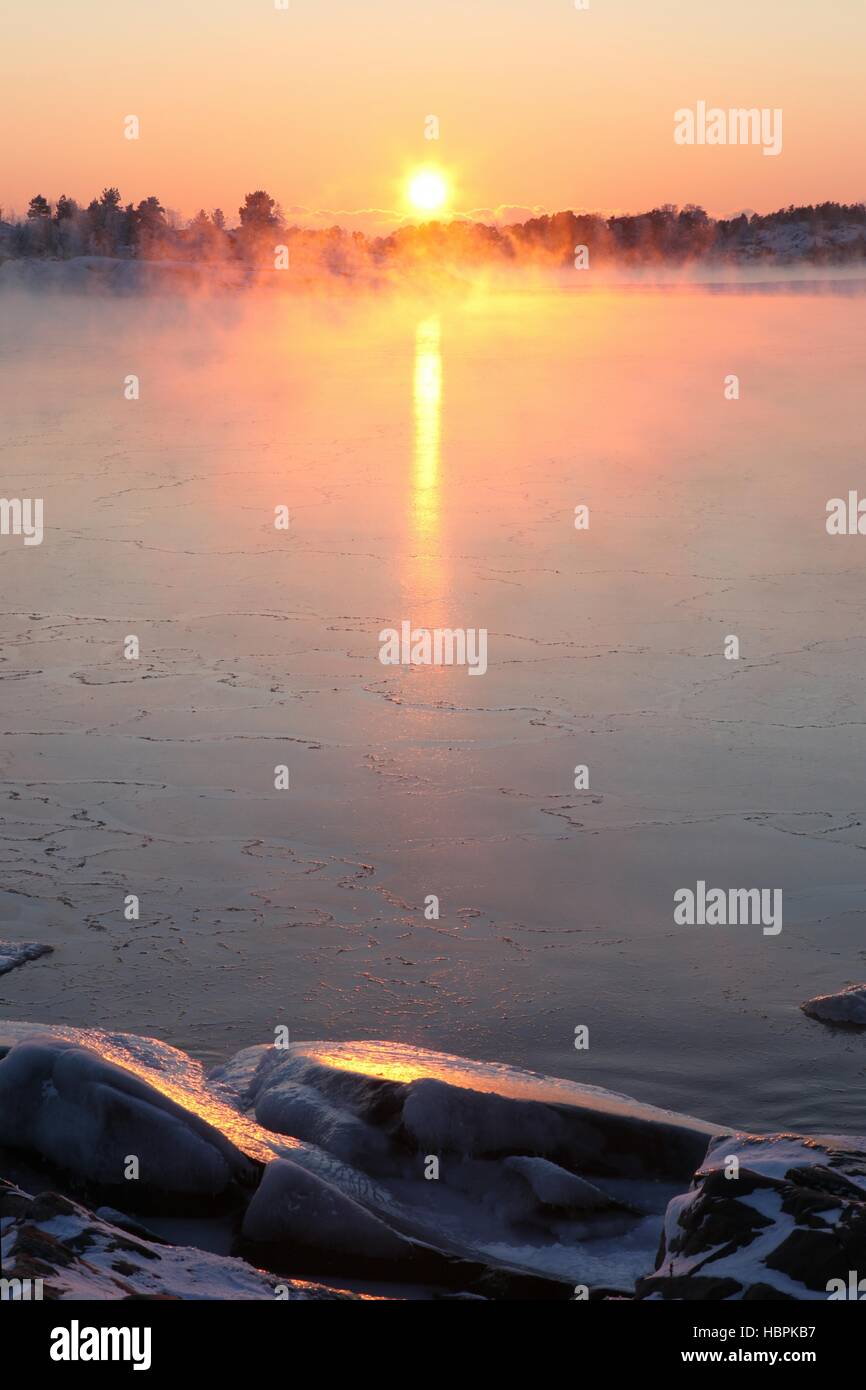Sunset at freezing sea Stock Photo - Alamy