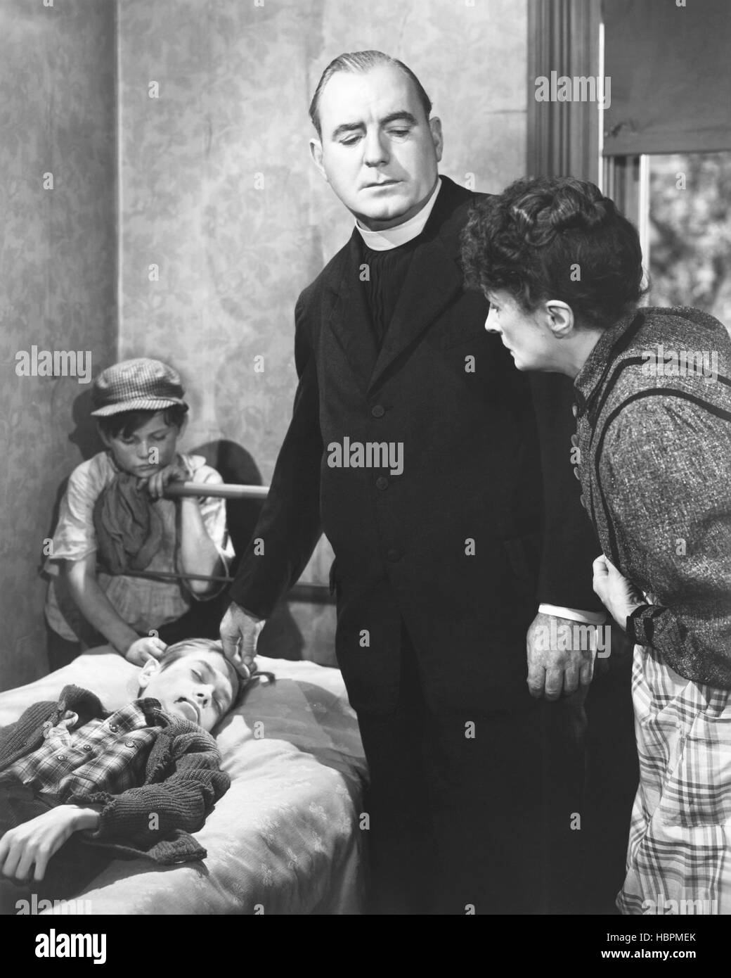 FIGHTING FATHER DUNNE, from left: Billy Gray (rear), Donn gift (lying ...