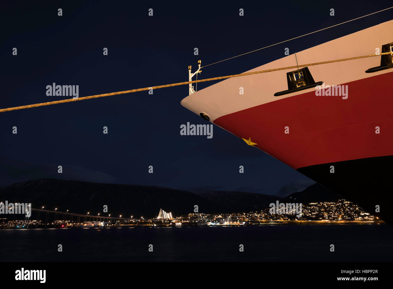 Hurtigruten MS Polarlys docked at Tromso with the Arctic Cathedral and ...