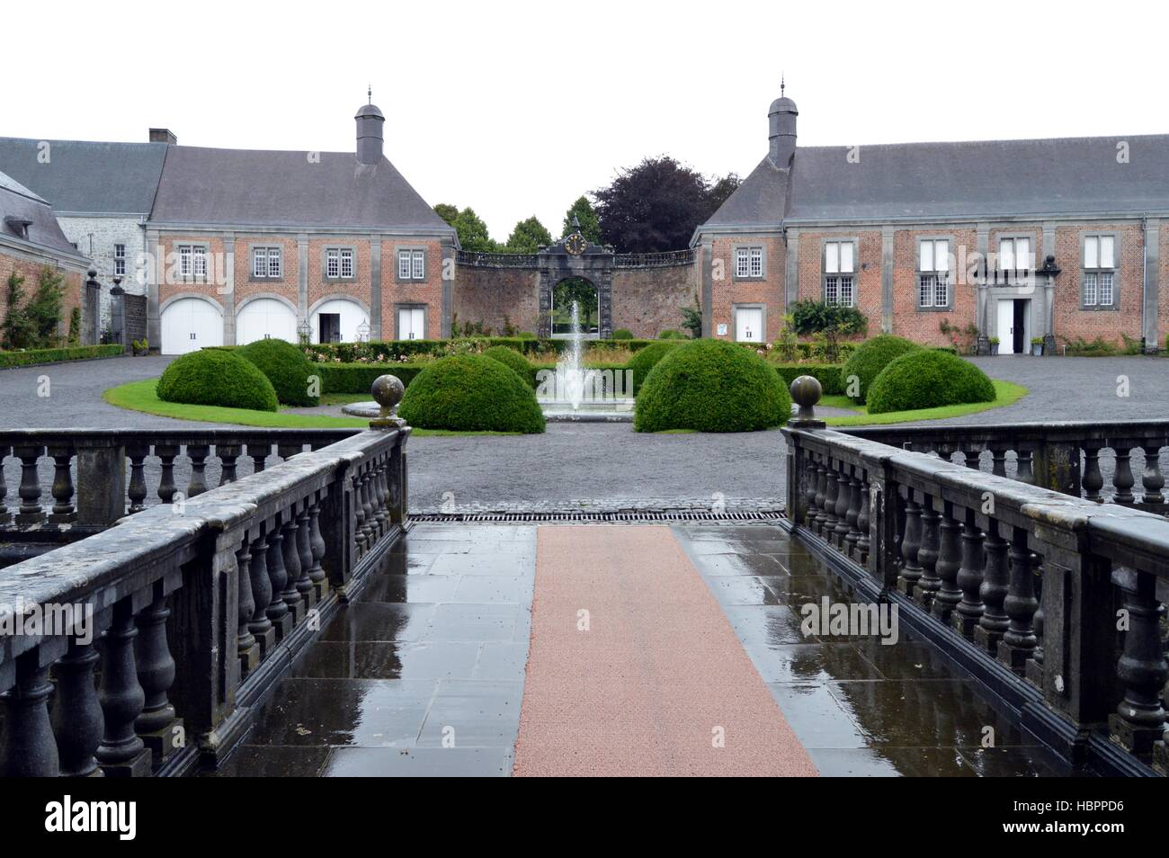 Court of castle with a water jet Stock Photo - Alamy