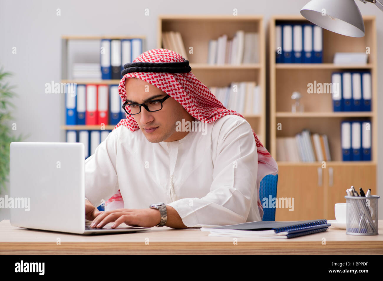 Arab businessman working in the office Stock Photo - Alamy