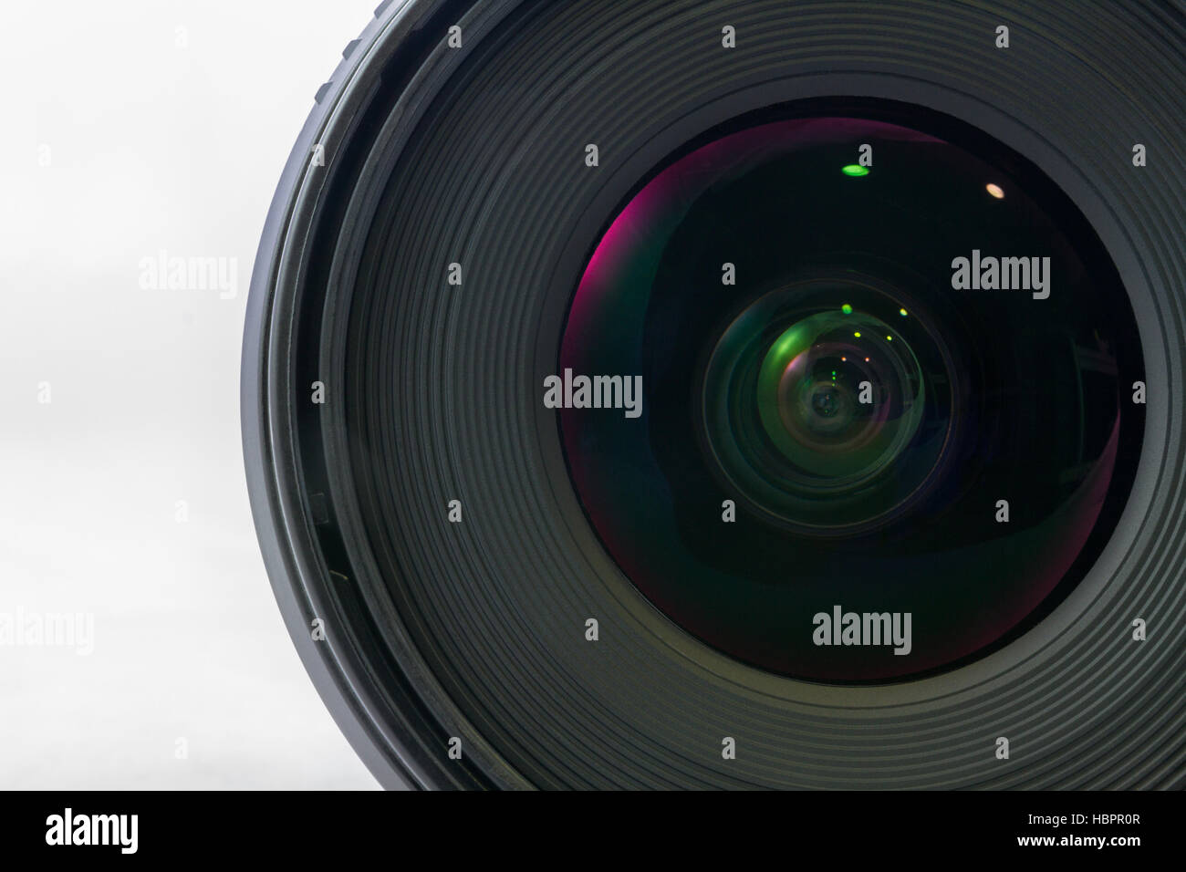 Front view of black camera lens isolated on white background, glass ...