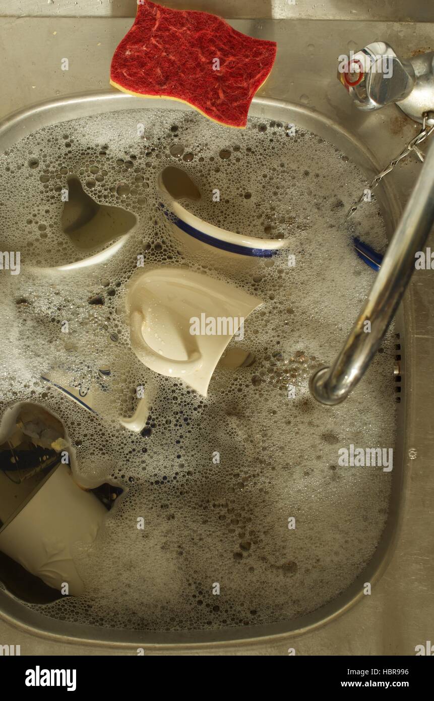 Washing up dishes hi-res stock photography and images - Alamy
