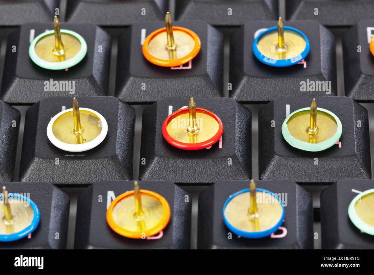 Pins on computer keyboard Stock Photo - Alamy