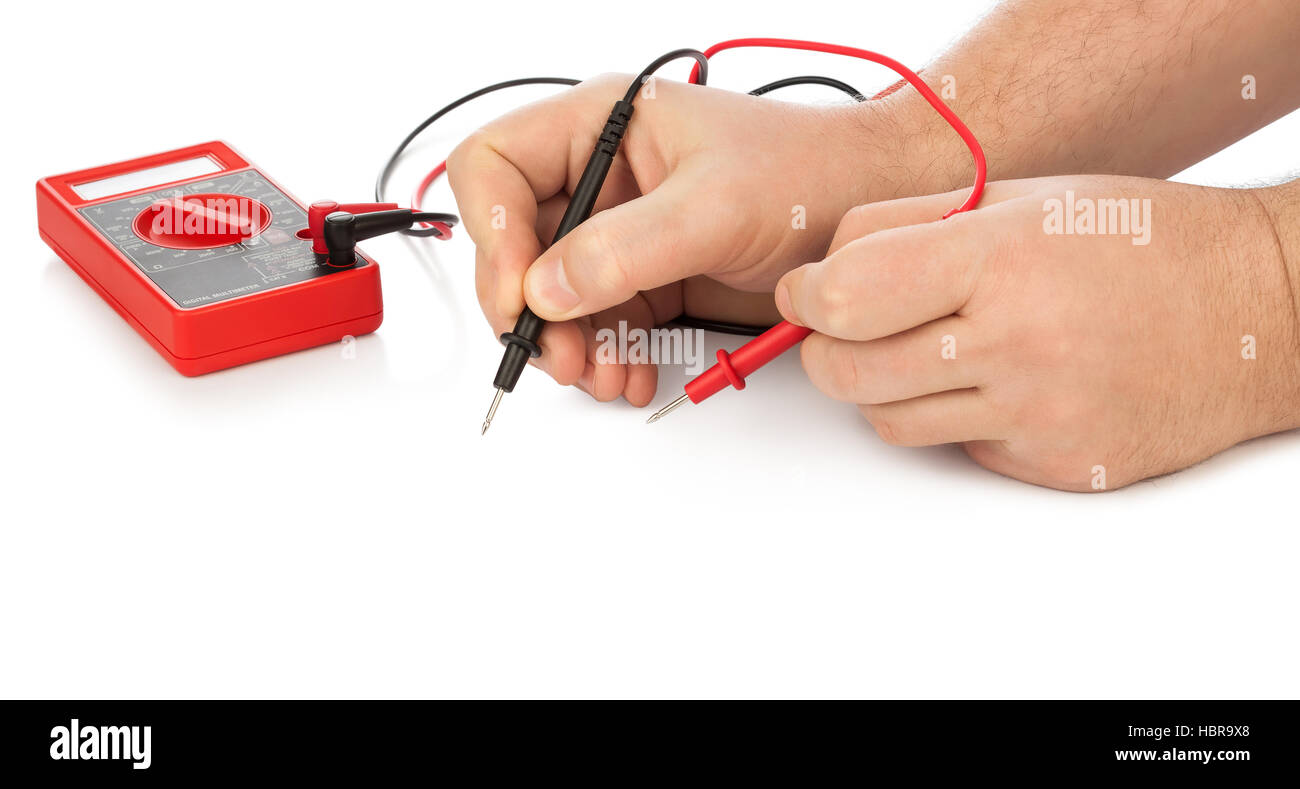 Hands and electric multimeter Stock Photo - Alamy