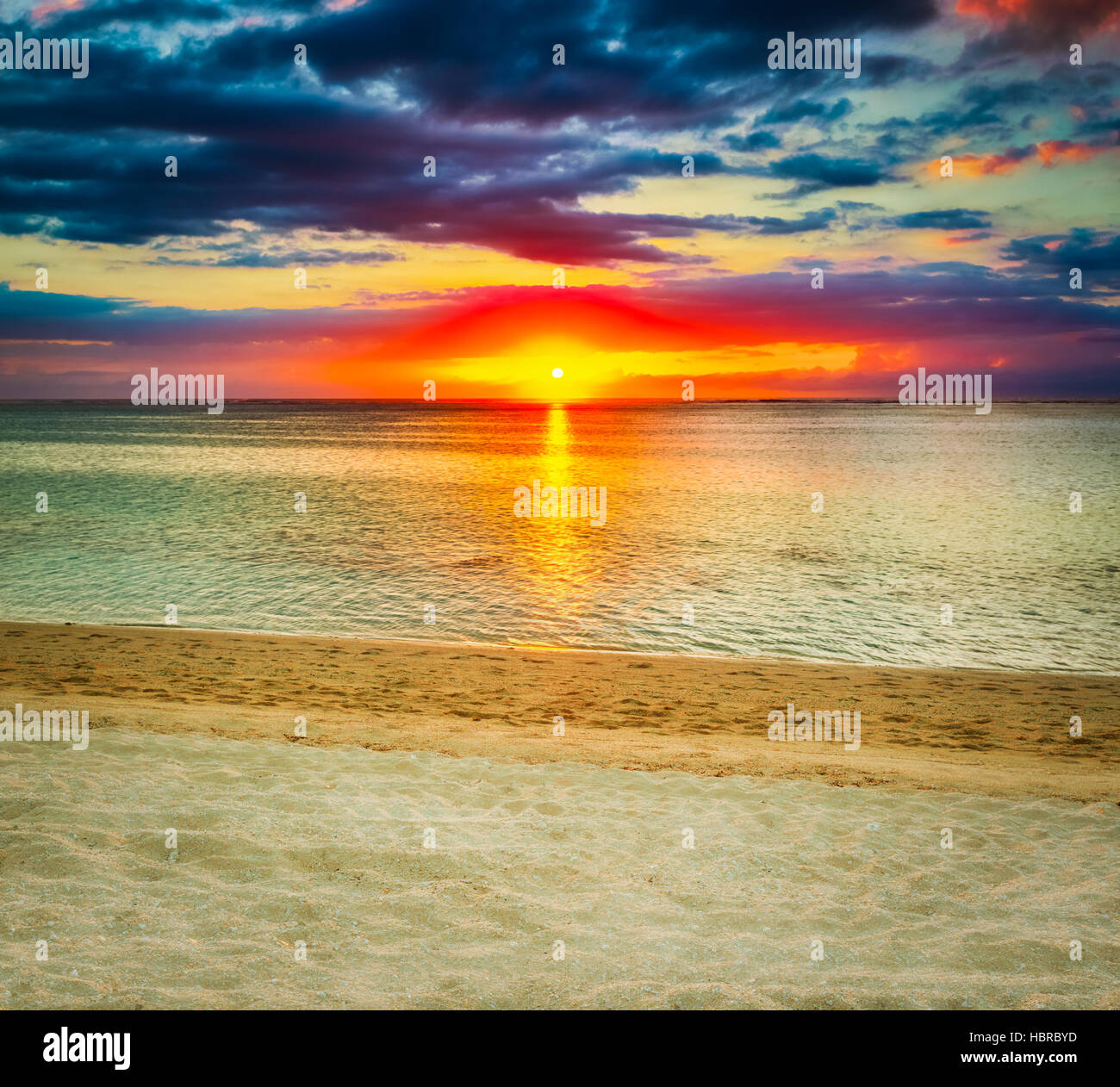 White sandy beach Le Morne at sunset. Mauritius Stock Photo - Alamy
