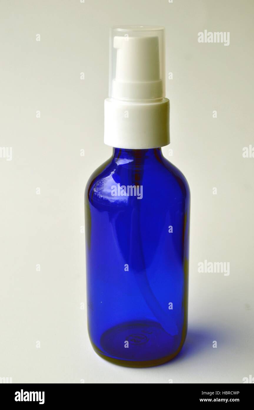 Group of dark blue cosmetic glass bottles for essential oils ...