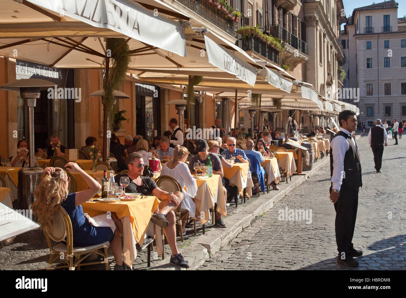 Piazza Navona, Rome, tourists dining at restaurant al fresco in the ...