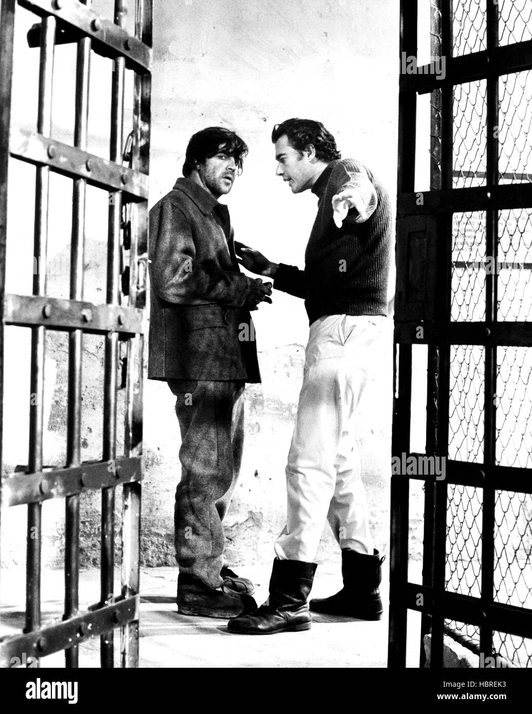 THE FIXER, from left, Alan Bates, director John Frankenheimer, on-set ...