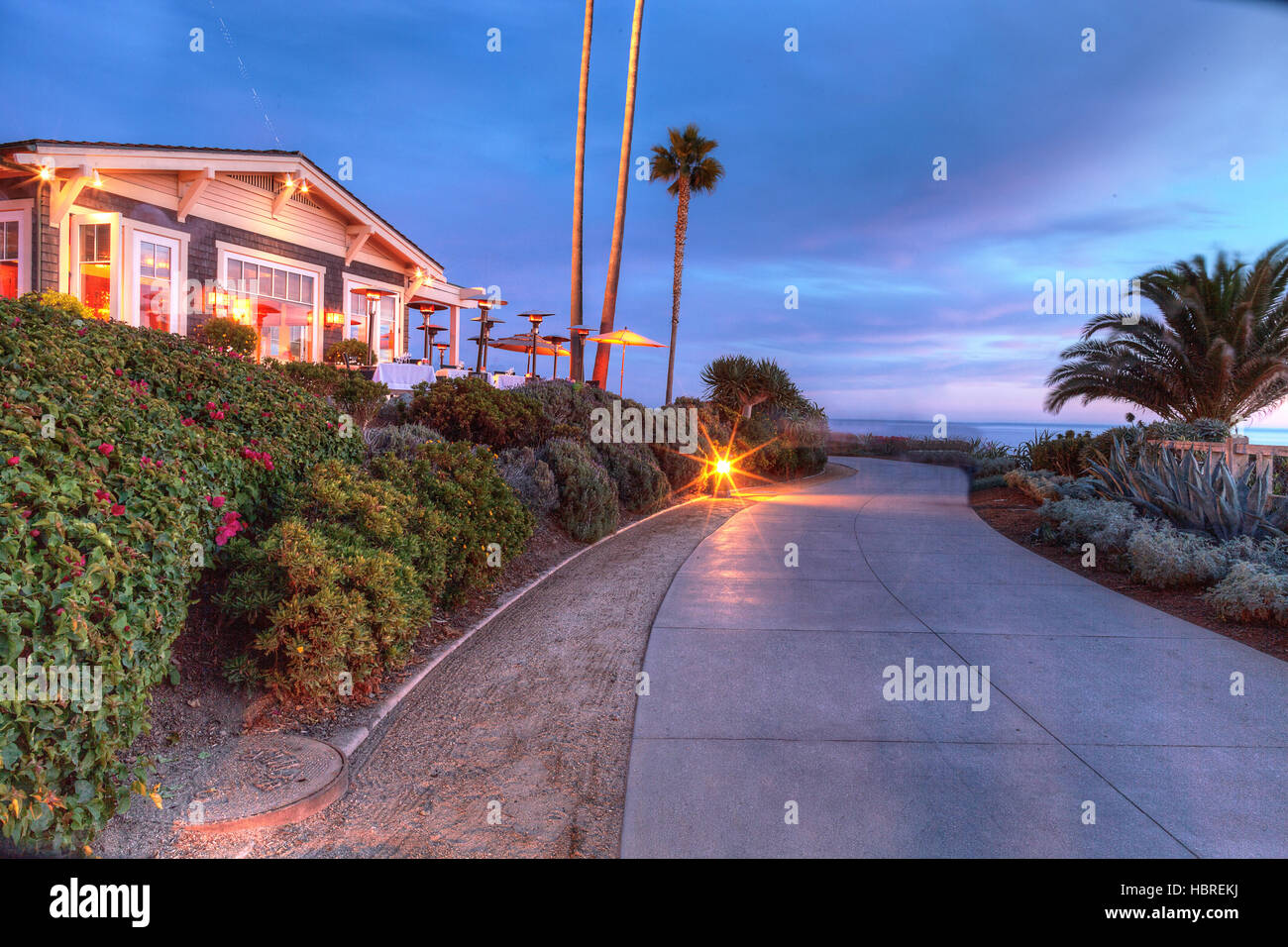 Sunset view of ocean view restaurant Stock Photo - Alamy