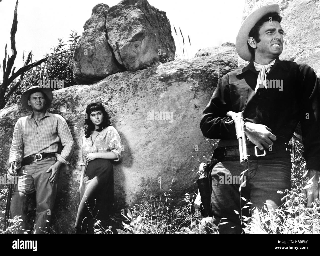 FLESH AND THE SPUR, from left: John Agar, Marla English, Mike 'Touch' Connors, 1957 Stock Photo ...