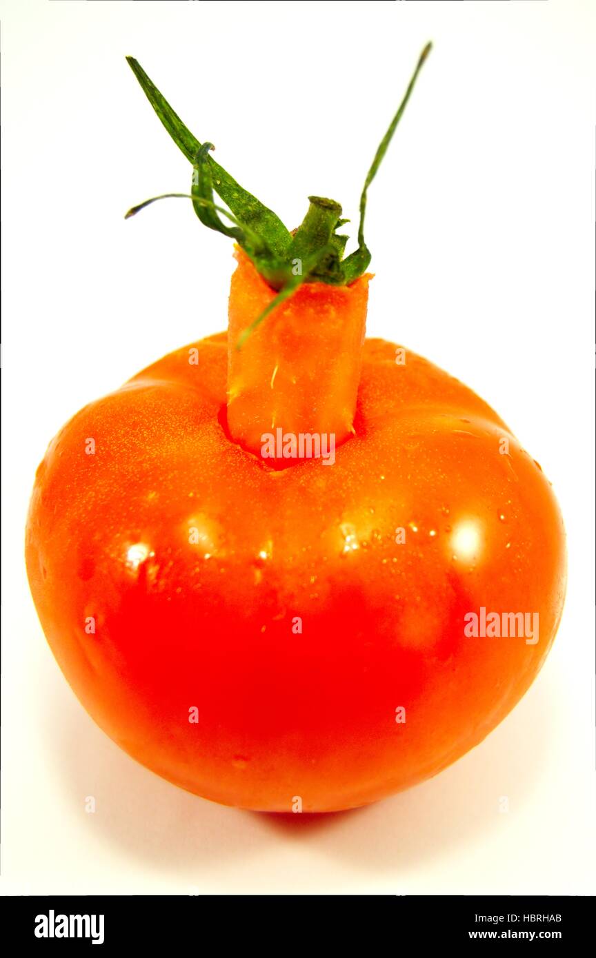 Red tomato deseeded on a white bottom Stock Photo - Alamy