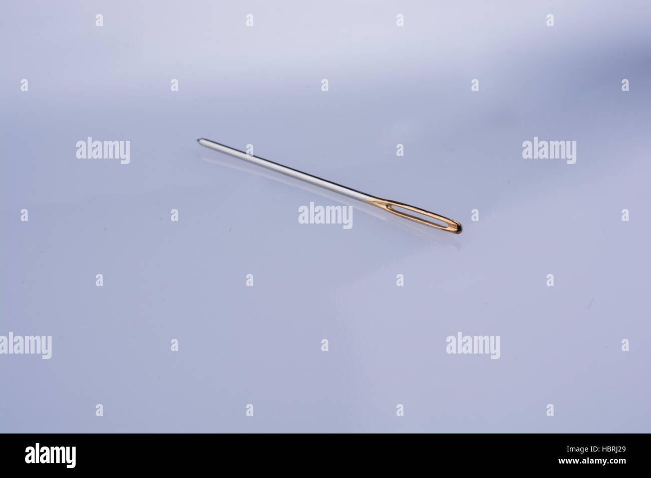 Sewing needle isolated on a white background Stock Photo - Alamy