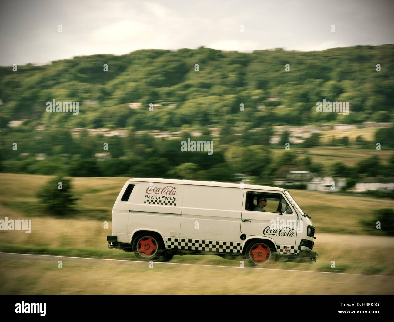 Speeding white Coca Cola T3 Volkswagen camper van near the Malvern ...