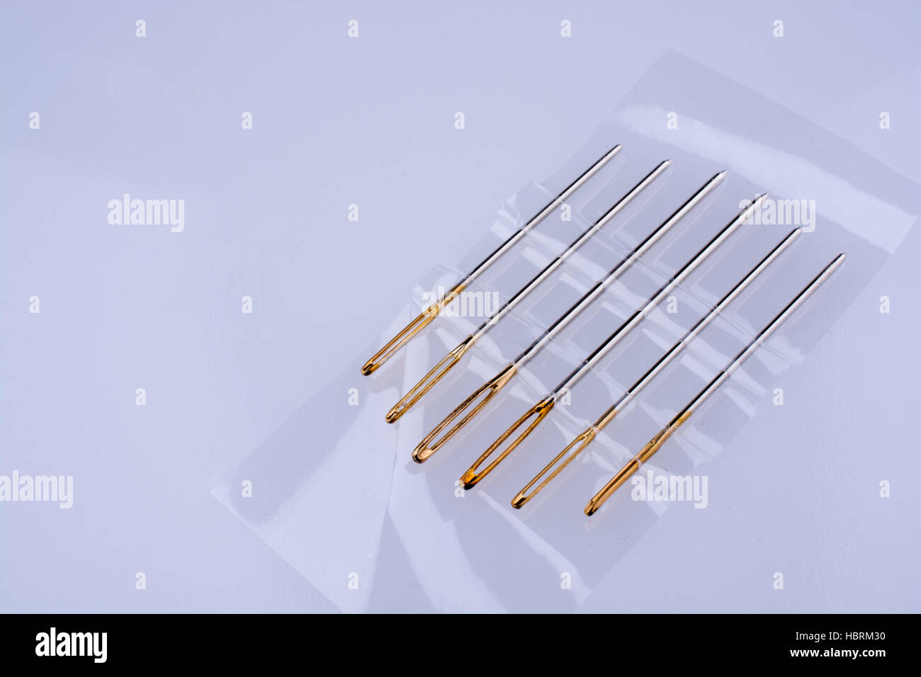 Six different sewing needles isolated on a white background Stock Photo ...