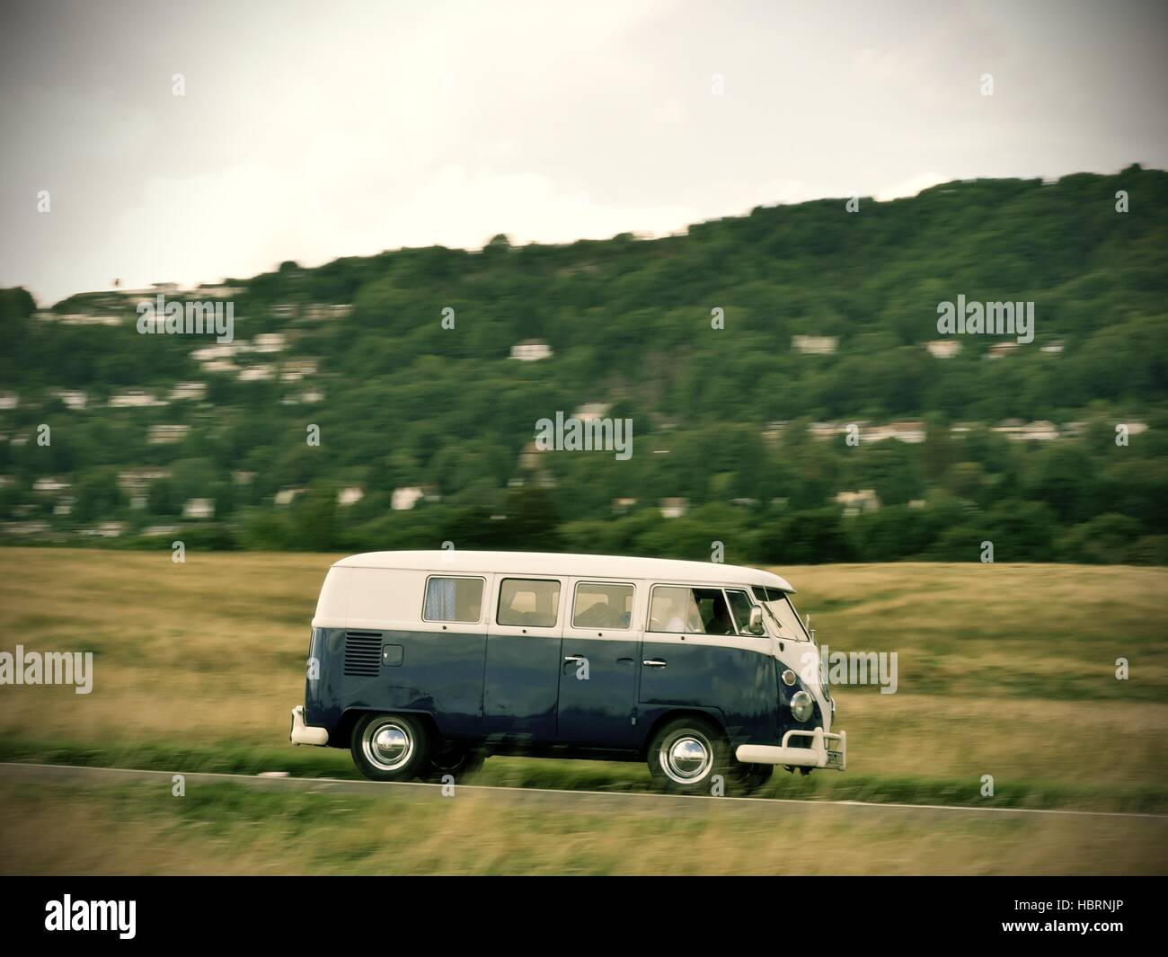 speeding dark blue two tone split screen volkswagen campervan near the ...