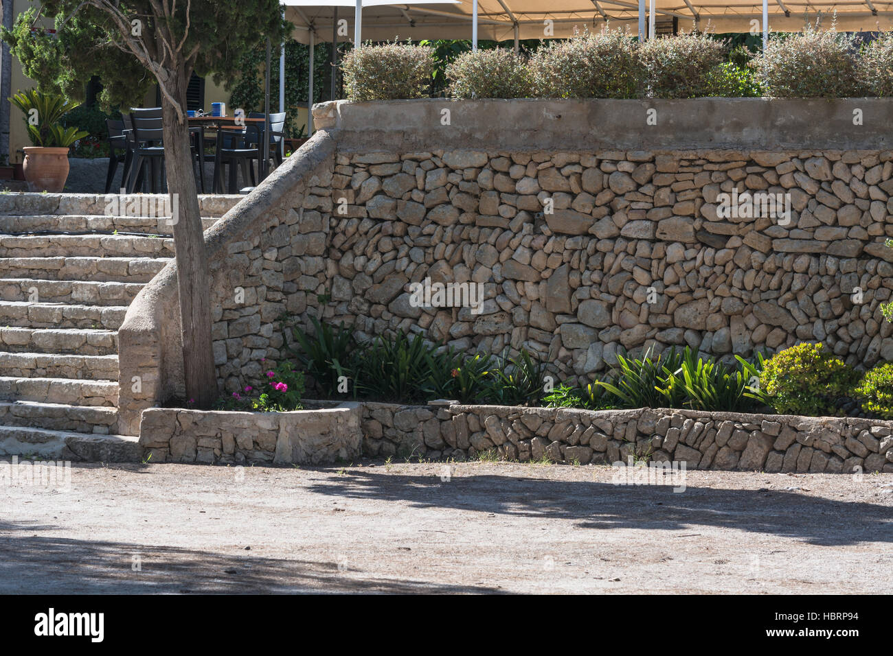Retaining wall made of natural stones Stock Photo - Alamy
