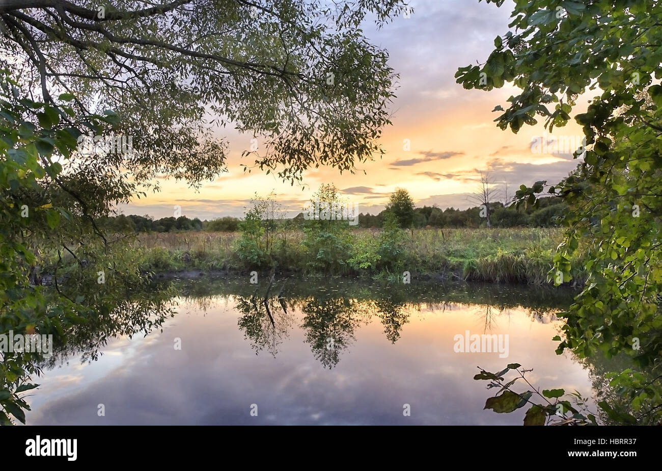 Colourful sunset over the river Stock Photo - Alamy