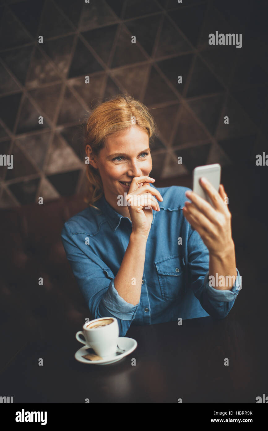 Young woman sitting in cafe , using telephone and drinking coffe Stock ...