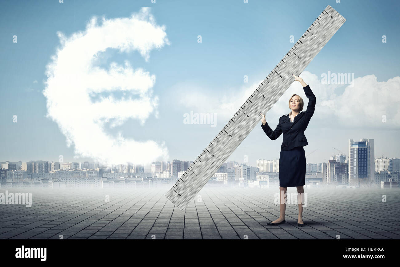 Woman with ruler Stock Photo - Alamy